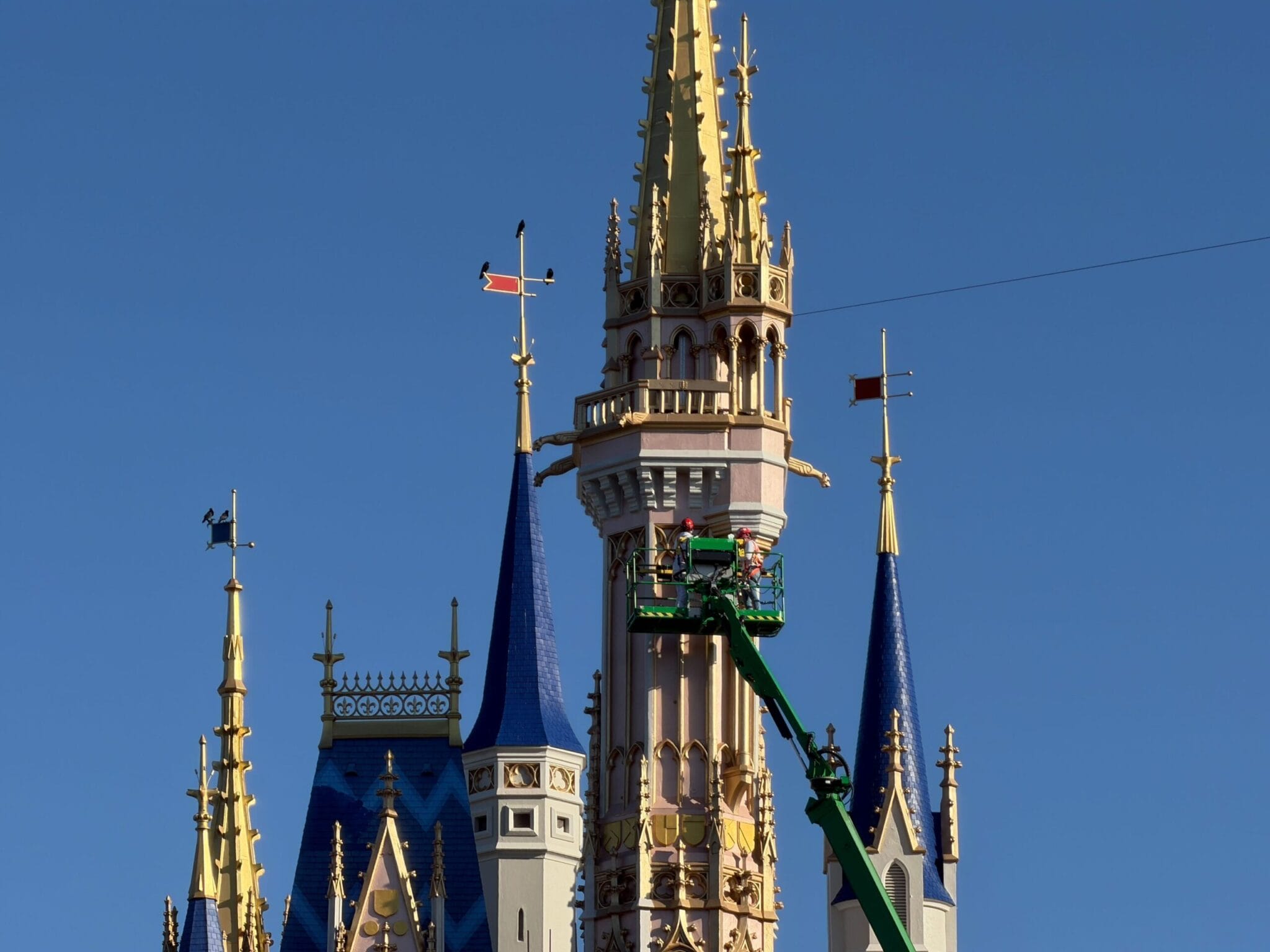 Crews Begin Painting Tallest Tower of Cinderella Castle at Magic ...