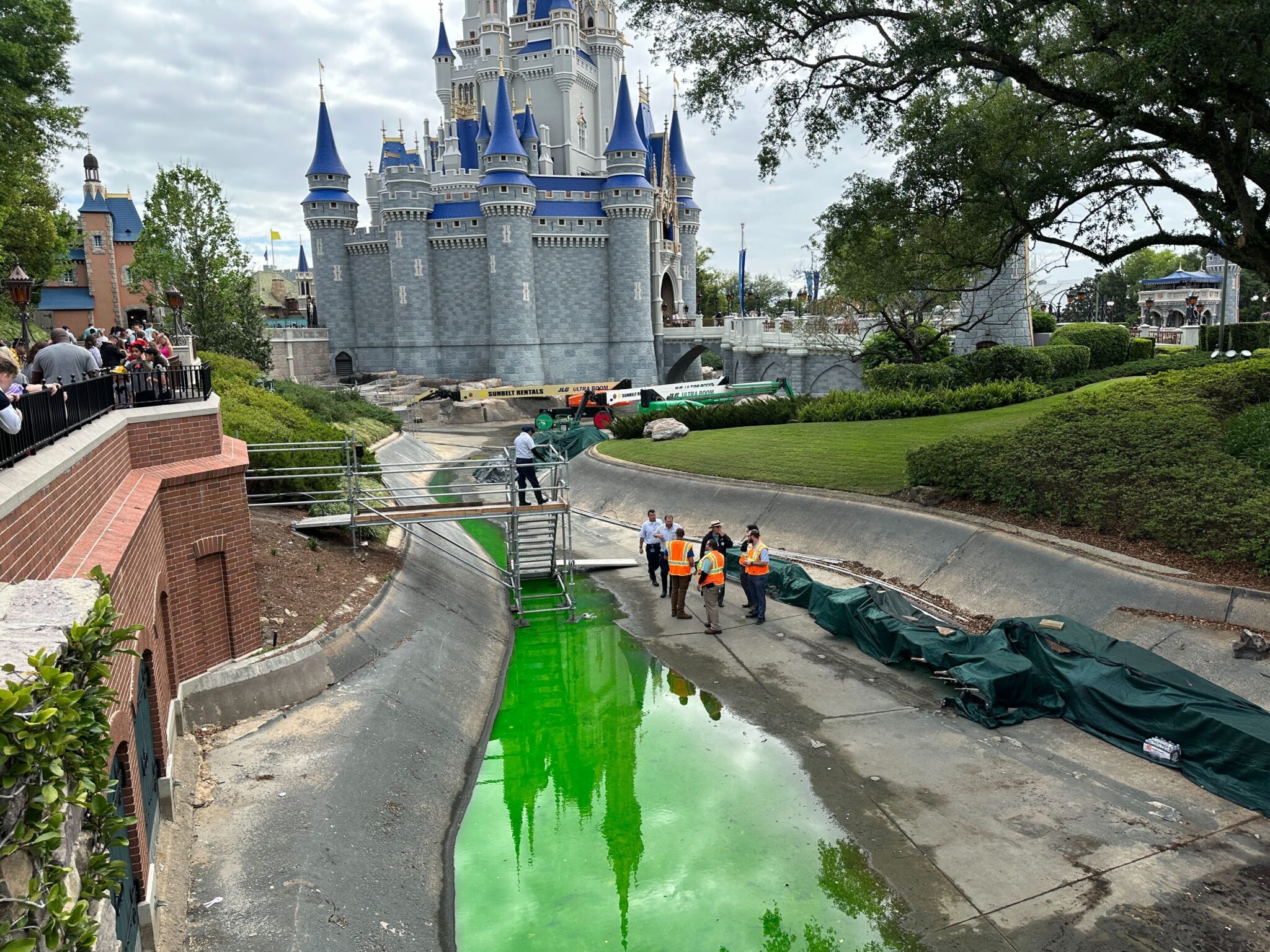 Crews Remove Fluorescent Green Water From Cinderella Castle Moat – This ...